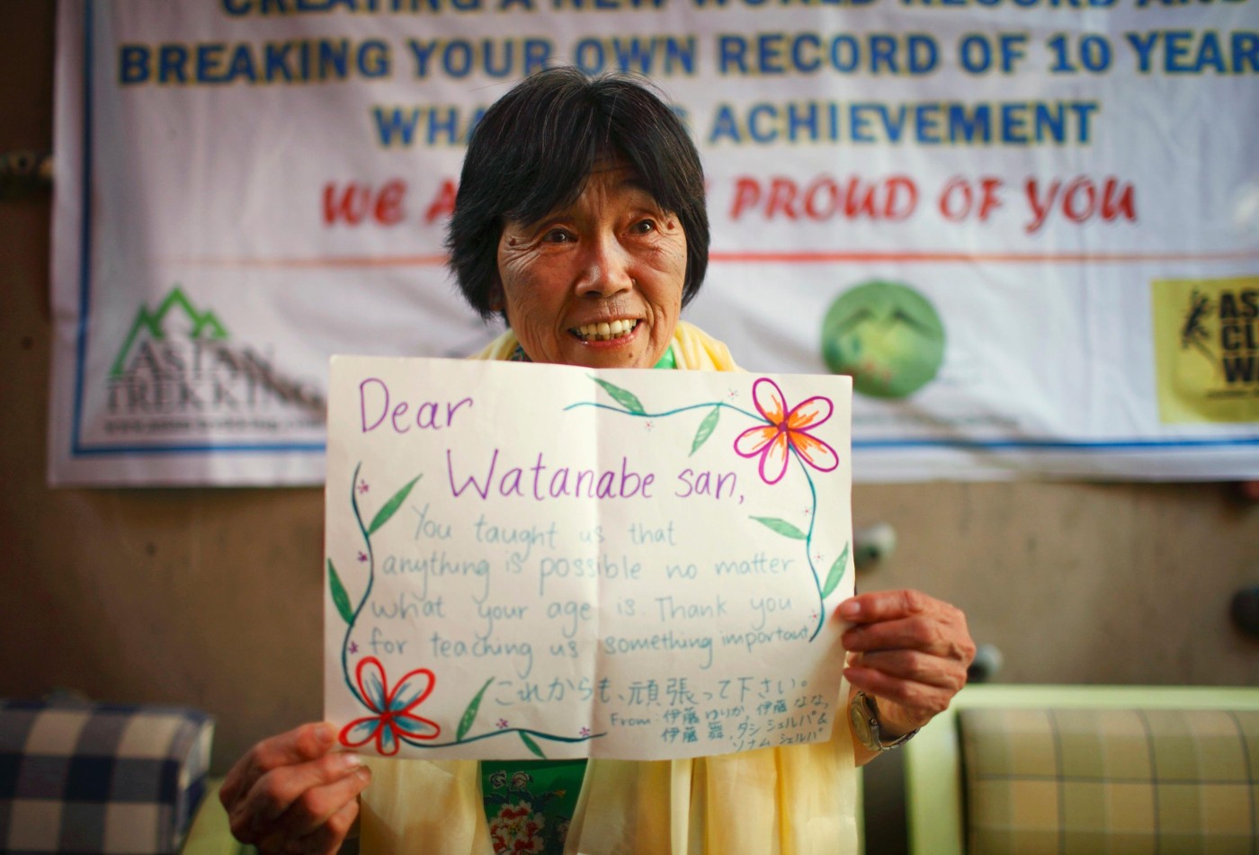 Tamae Watanabe of Japan shows a letter that was presented to her during ...