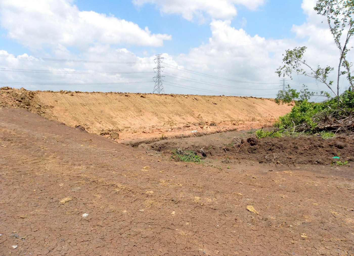 A view shows a large earthen dike under construction at Hi-Tech ...