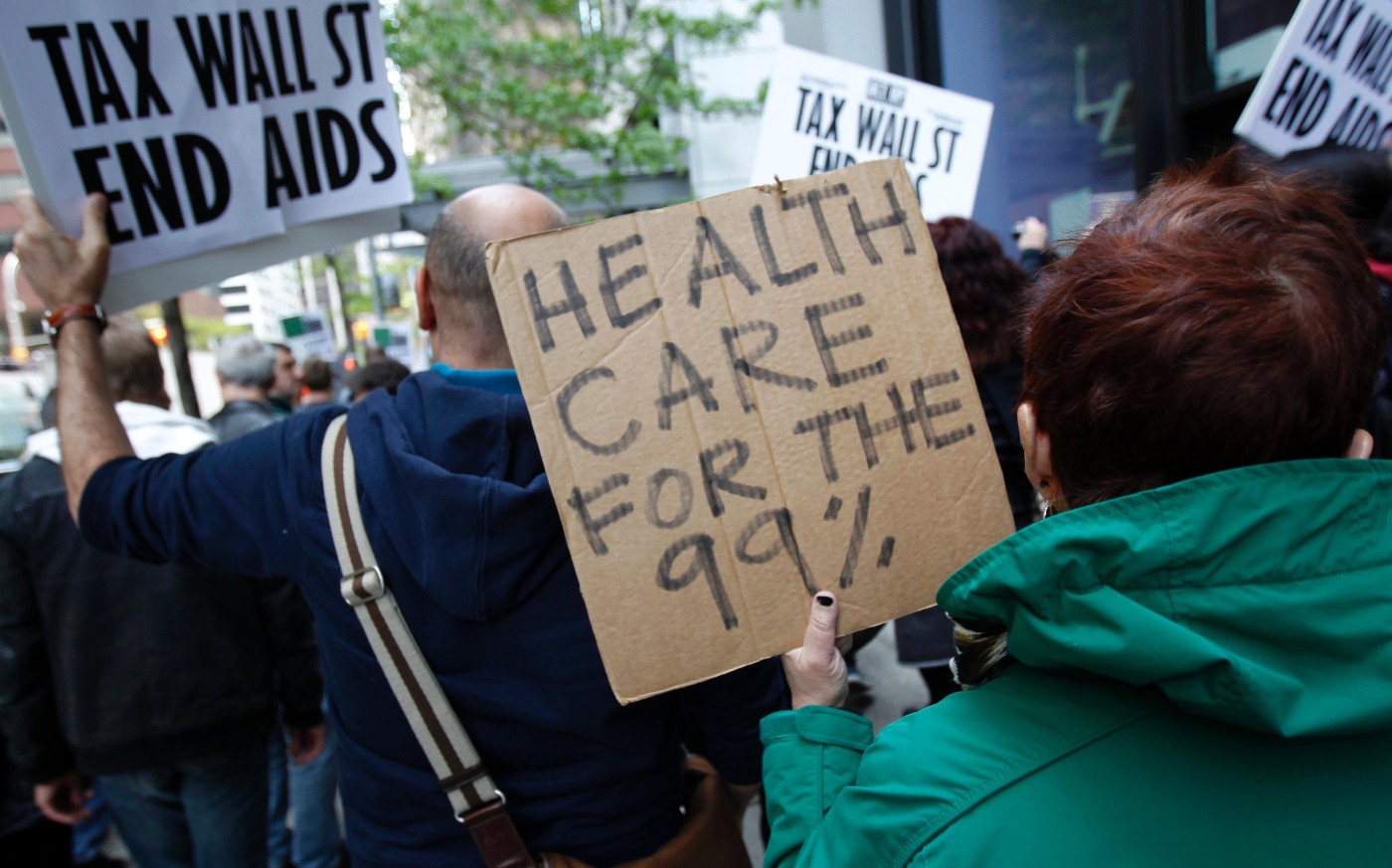 A demonstrator affiliated with "AIDS Coalition to Unleash Power" (Act ...