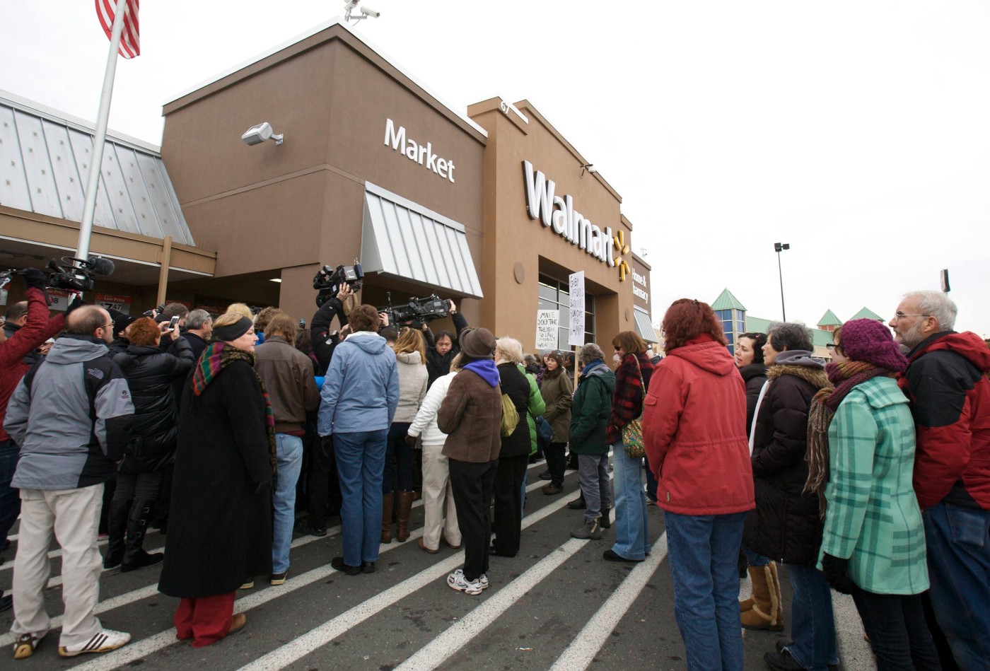 Protesters gather to deliver a petition to Walmart in Danbury, Connecticut