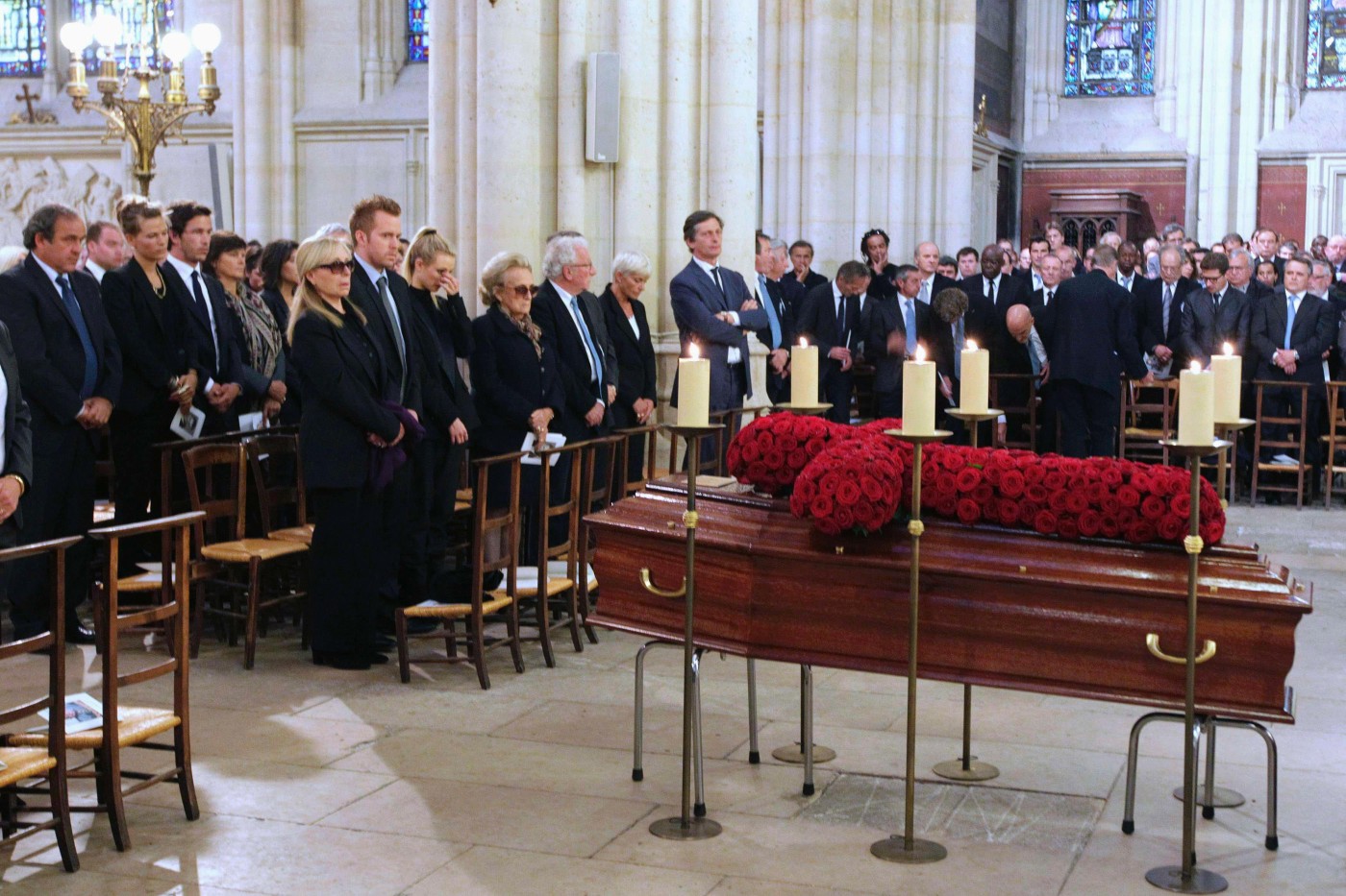 Flowers cover the coffin of French soccer commentator Thierry Roland ...