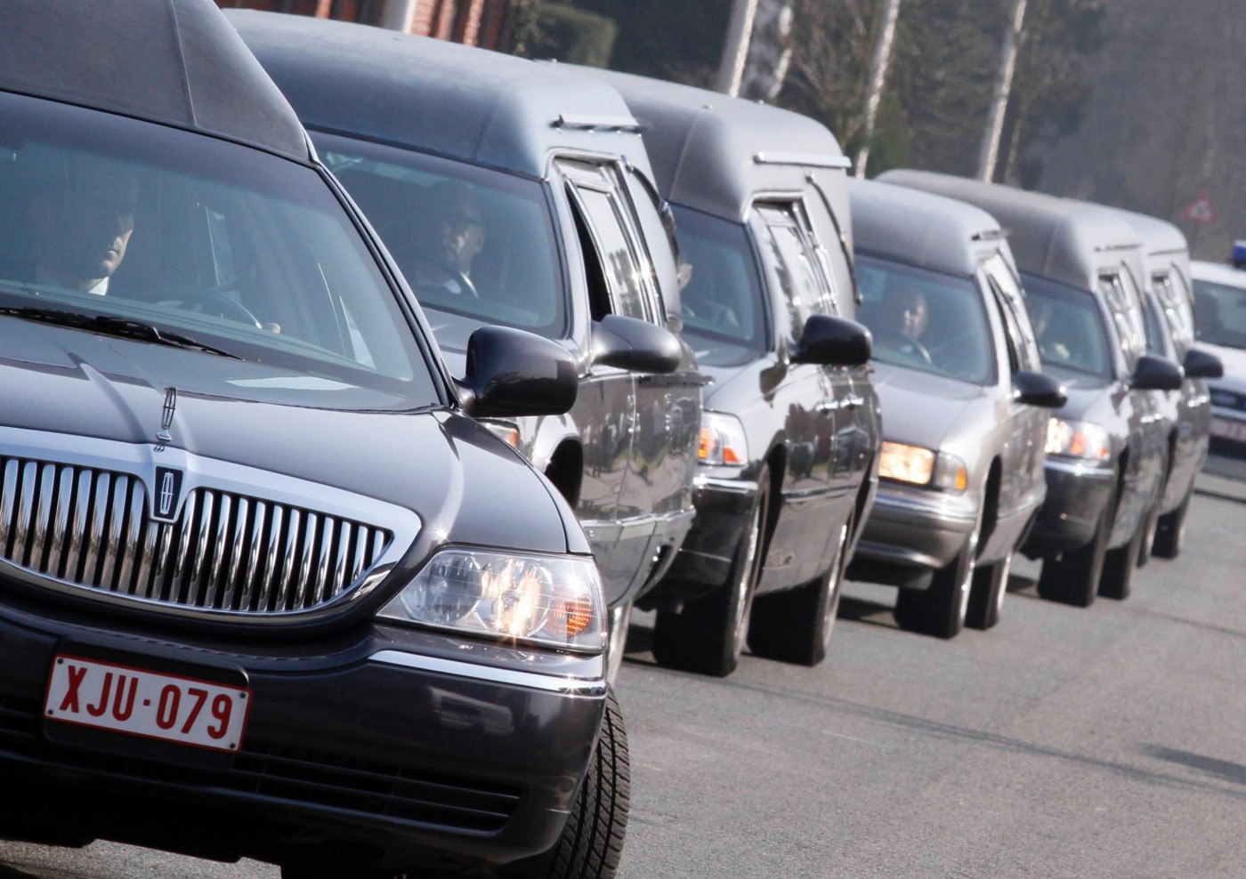 A convoy of hearses transporting the coffins of victims of the Sierre ...