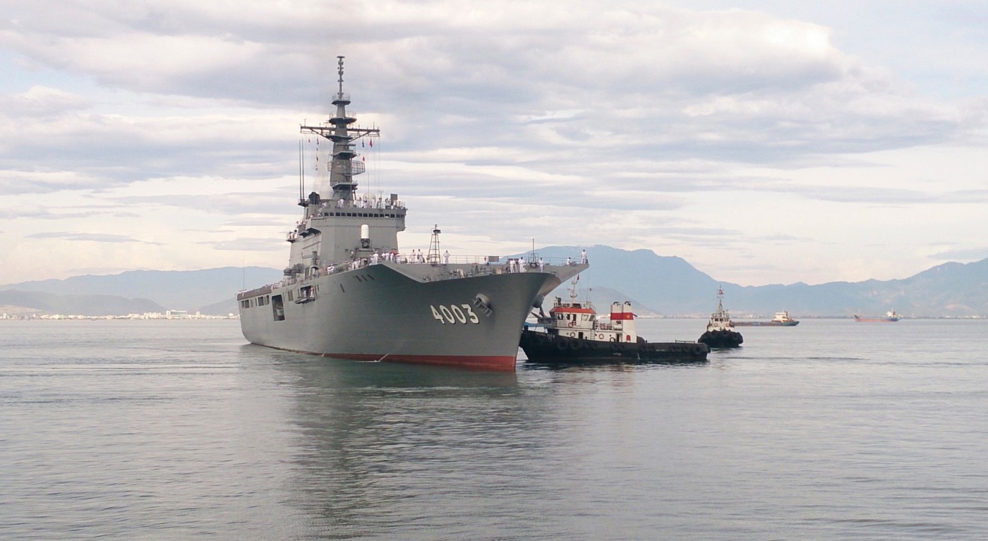 Sailors stand onboard Japan Maritime Self-Defense Force Osumi-Class JS ...