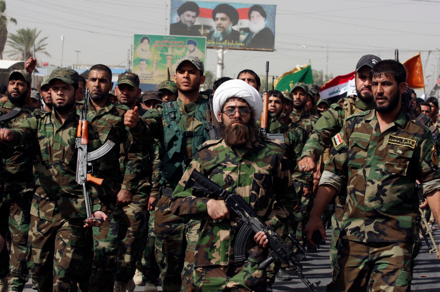 Mehdi Army fighters loyal to Shi'ite cleric Moqtada al-Sadr march ...
