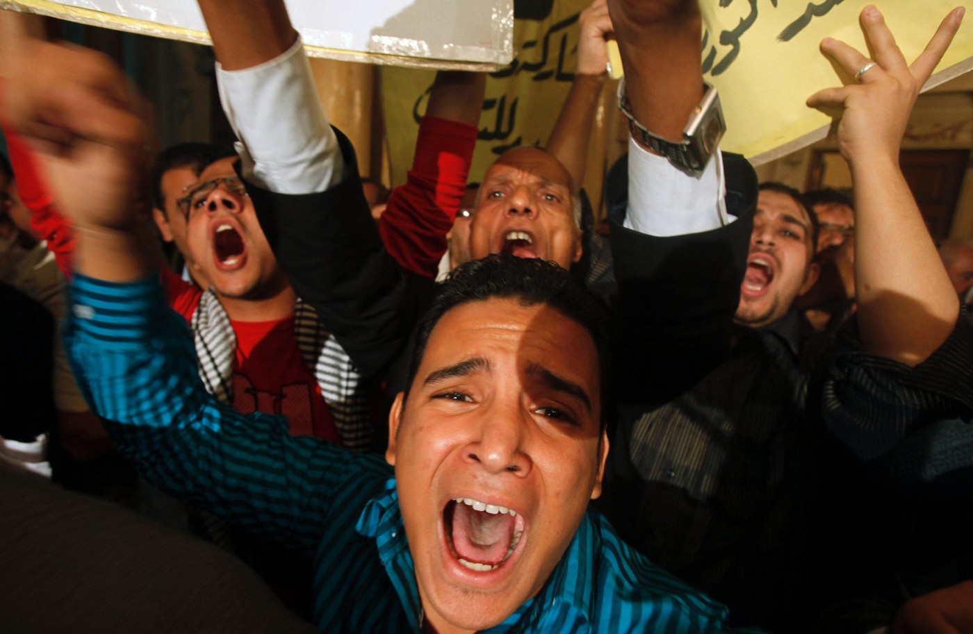 Supporters of Egypt's Liberal Wafd party shout slogans as they call for ...