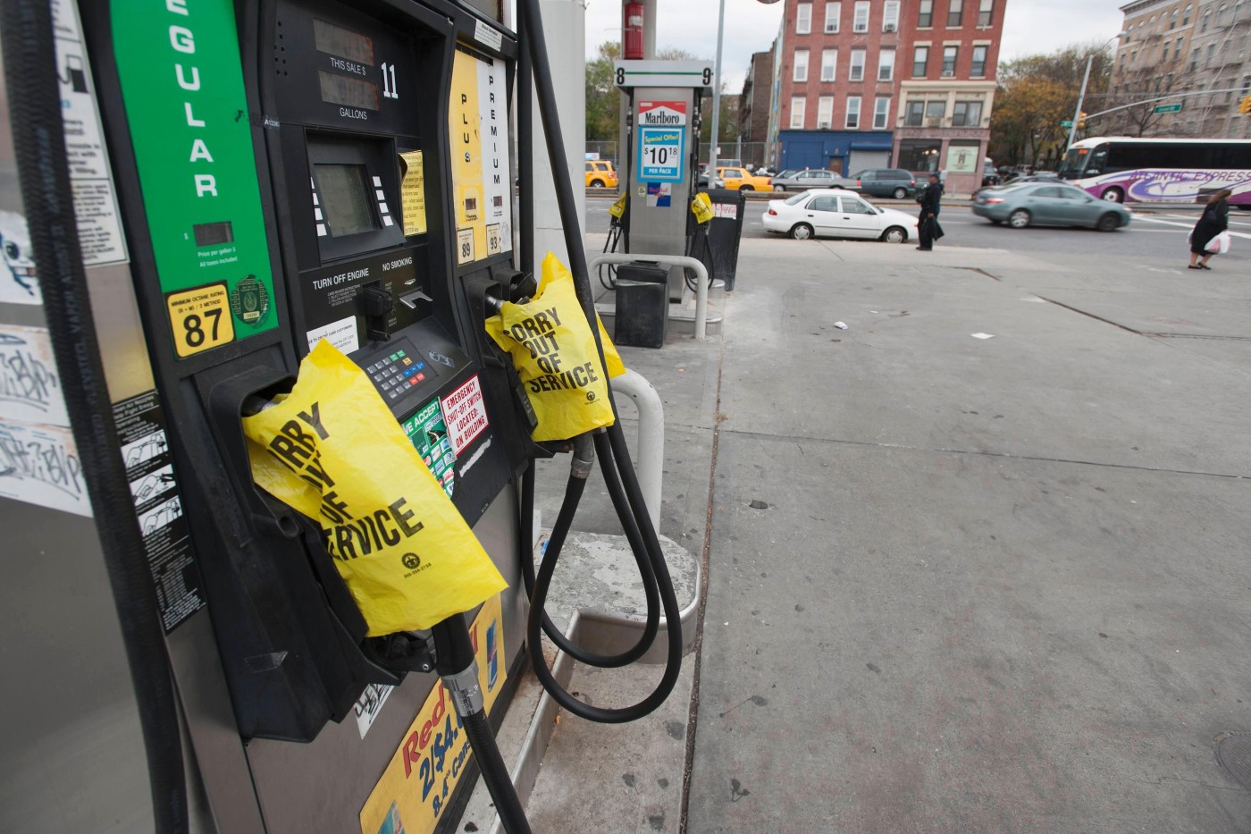 Out of service signs are seen on the pumps of a gas station that is out ...