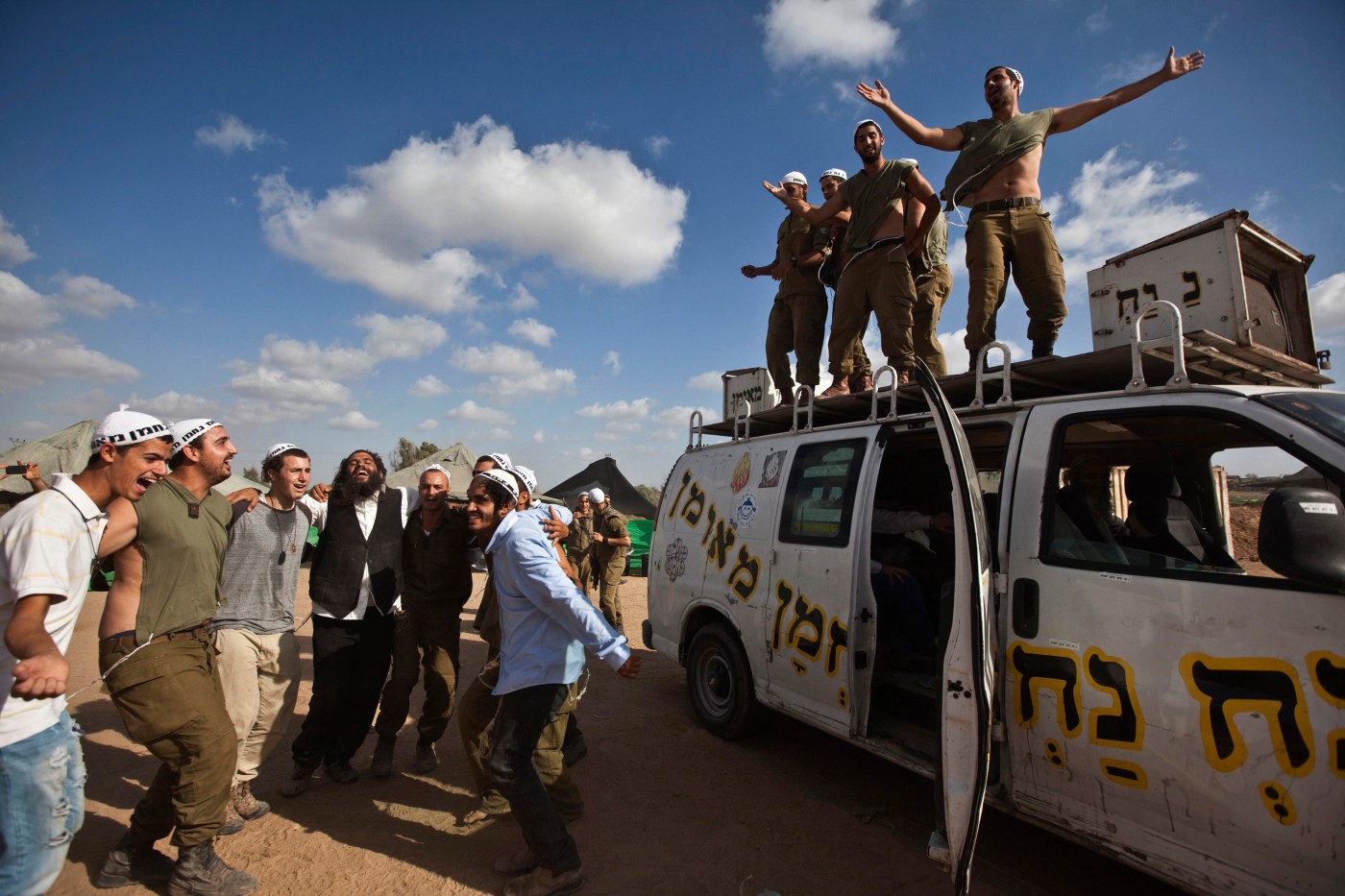 Hasidic Jews from the Breslov sect dance with Israeli soldiers during a ...