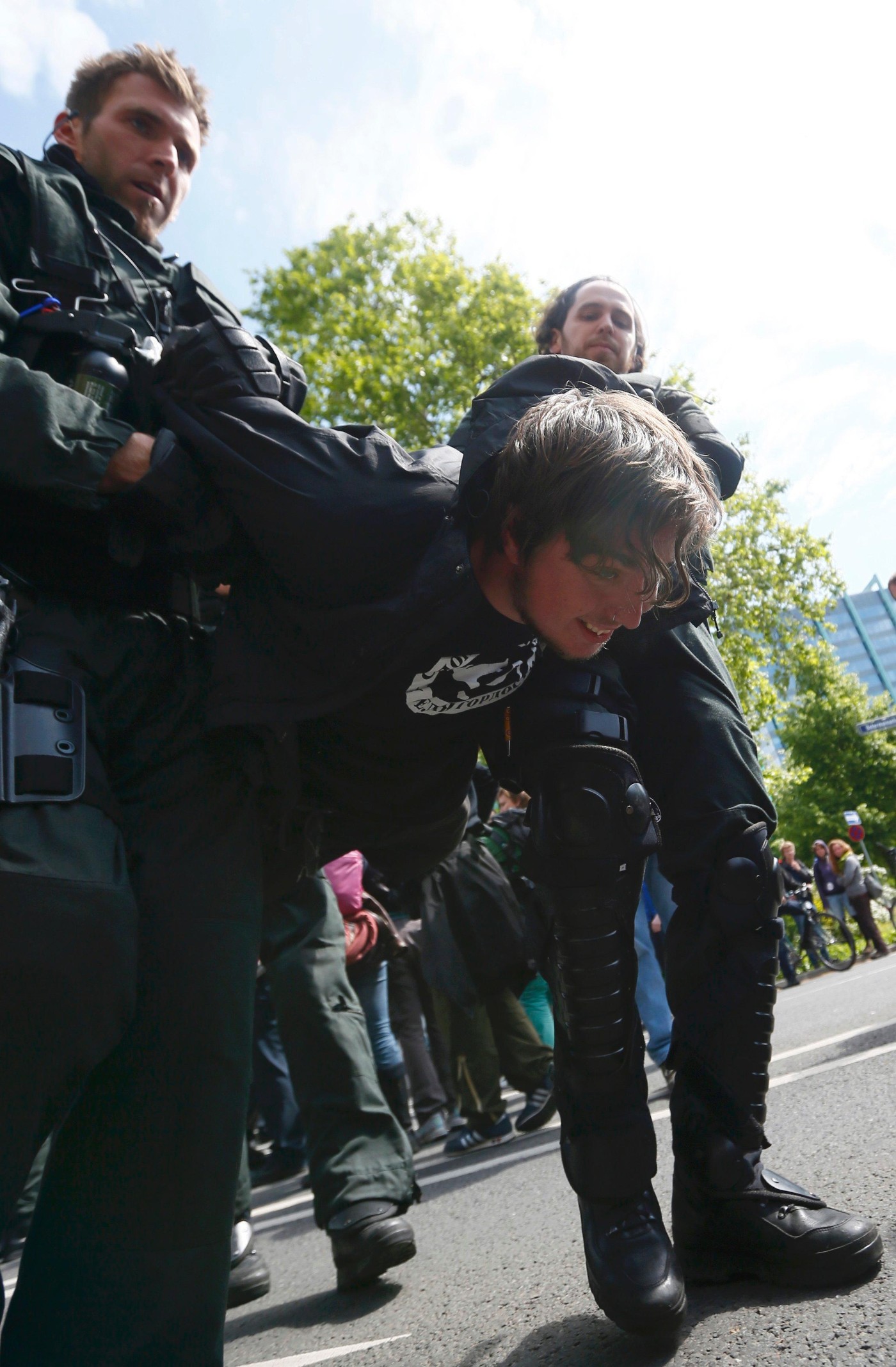German riot police remove a protester during during an anti-austerity ...