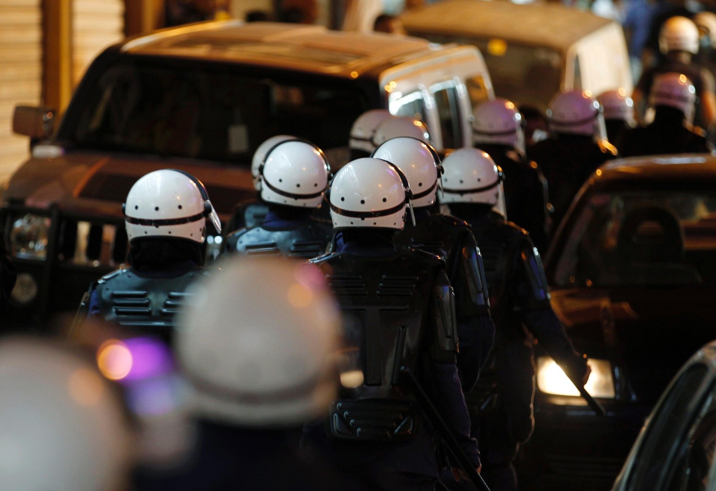 Women riot-police are seen running towards anti-government protesters ...