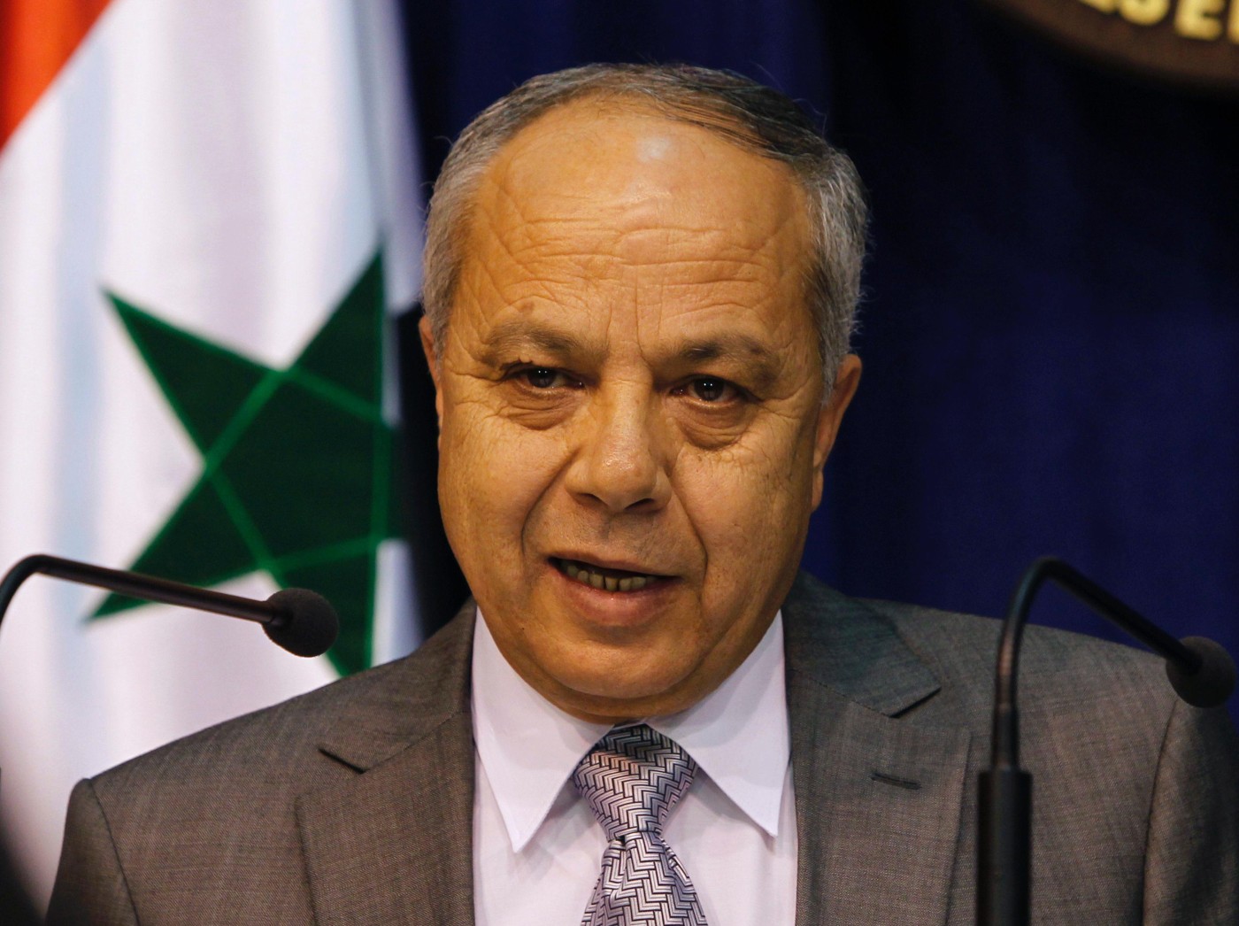 Brigadier General Suleiman reads out an initial report of the Houla ...