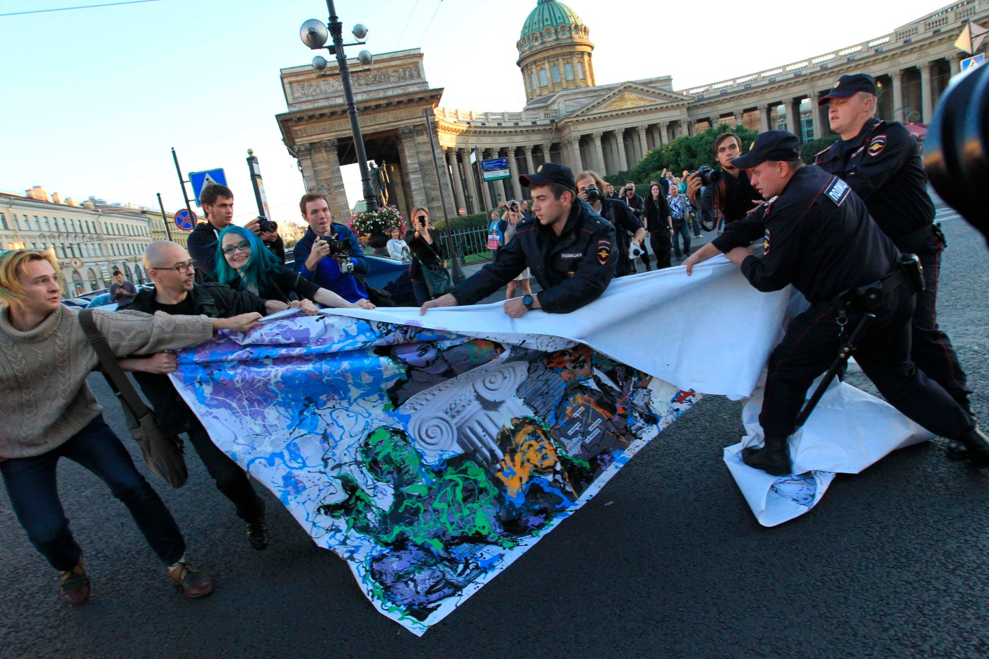 Policemen prevent members of radical artist group Voina (War) from ...