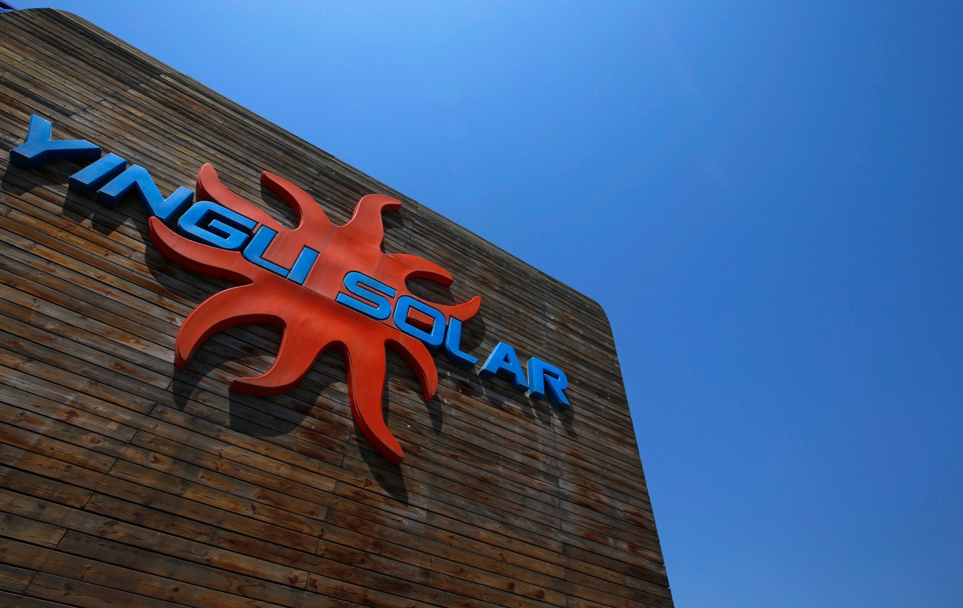 A logo of Yingli Solar is seen on a wall inside the company, in Baoding