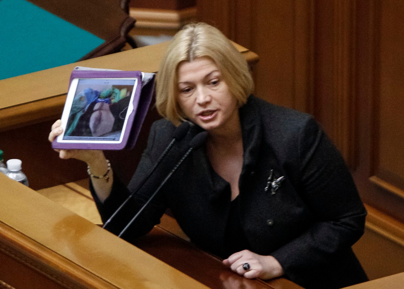 An opposition deputy Irina Gerashenko shows a picture of a wounded anti ...