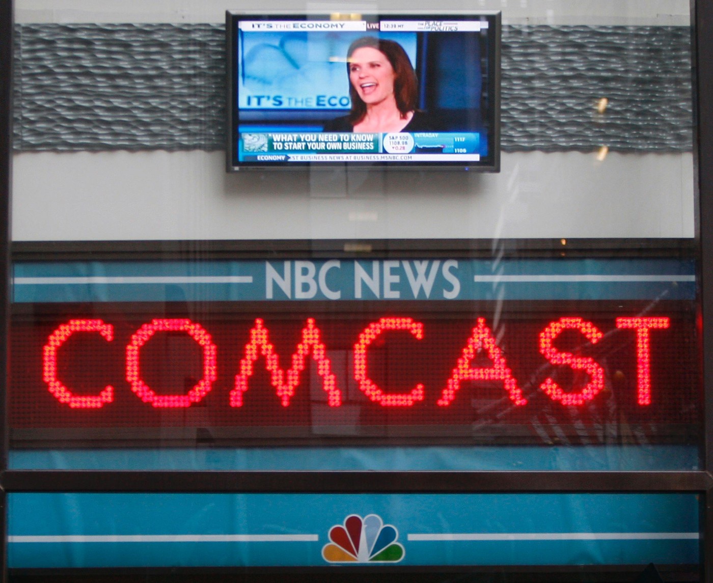 The news ticker outside the Today Show announces GE's sale of NBC to ...